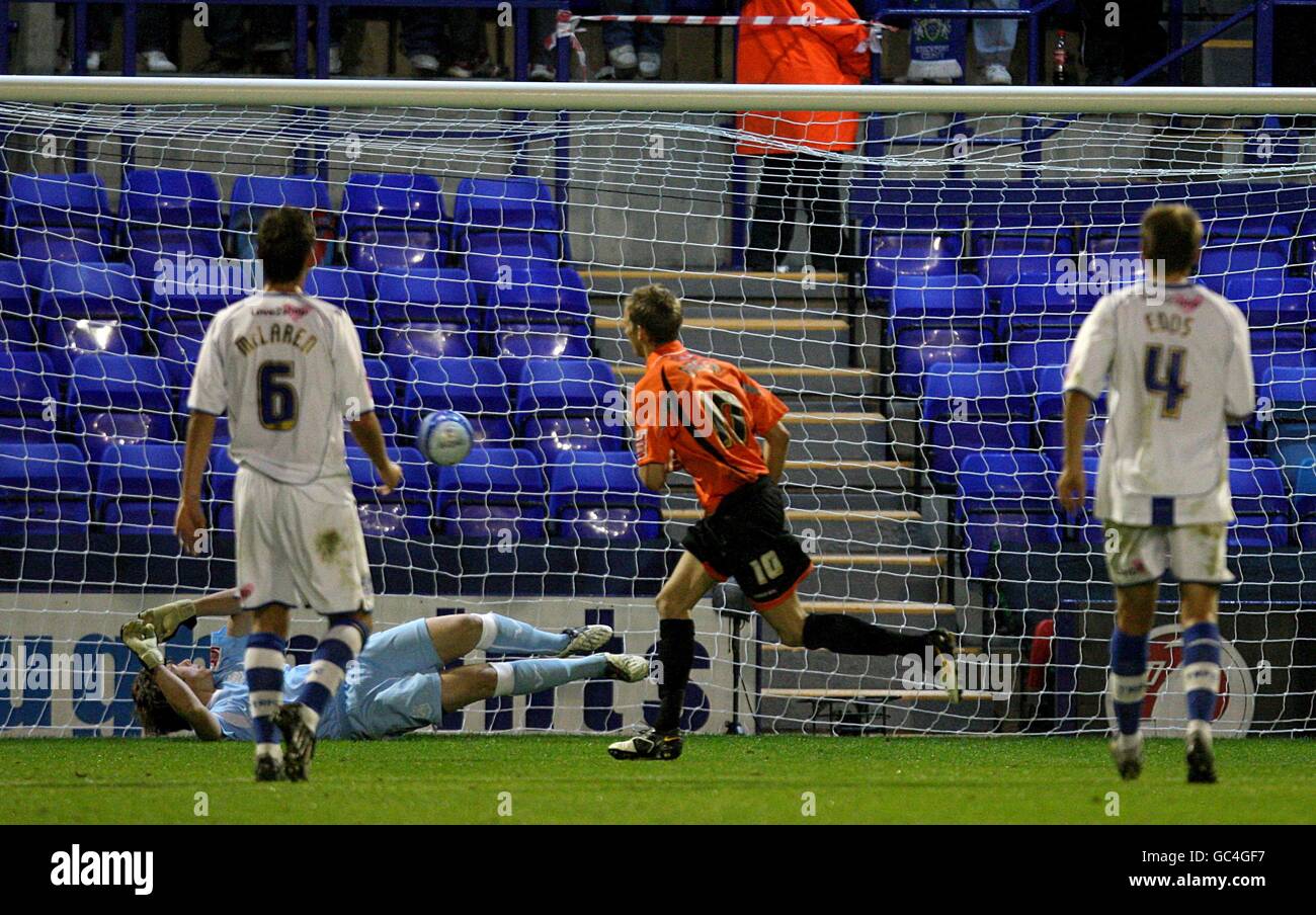 Stockport County's Carl Baker (centre) celebrates after scoring from ...