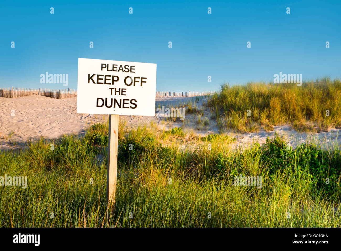 Sign at beach warns to keep off the dunes for environmental protections ...