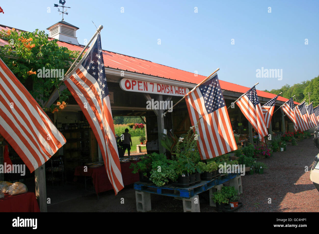 Farmer's market country store with US flags Stock Photo - Alamy