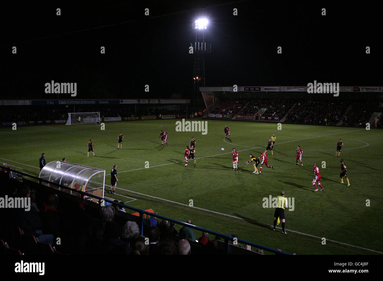General view of the action being played under floodlights at Whaddon ...