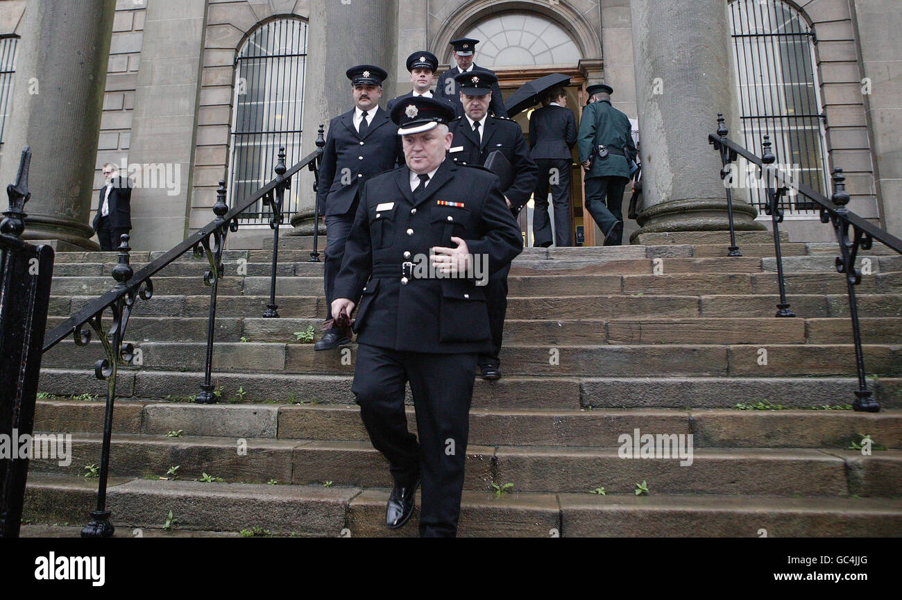 Members of the Northern Ireland fire and rescue service leaving Omagh ...