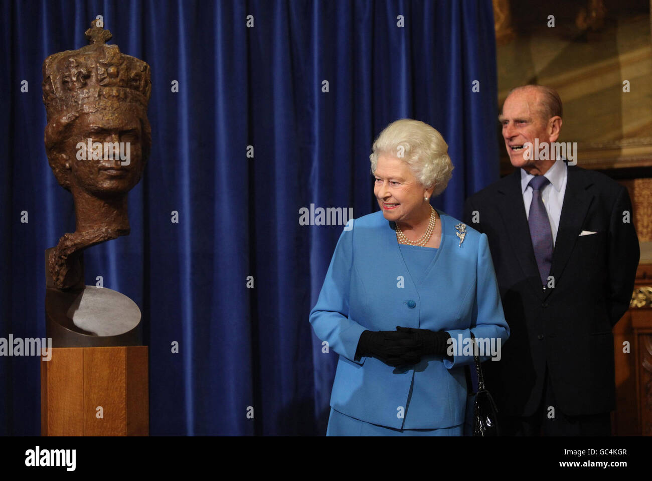 The Duke of Edinburgh looks on as Britain's Queen Elizabeth II unveils ...