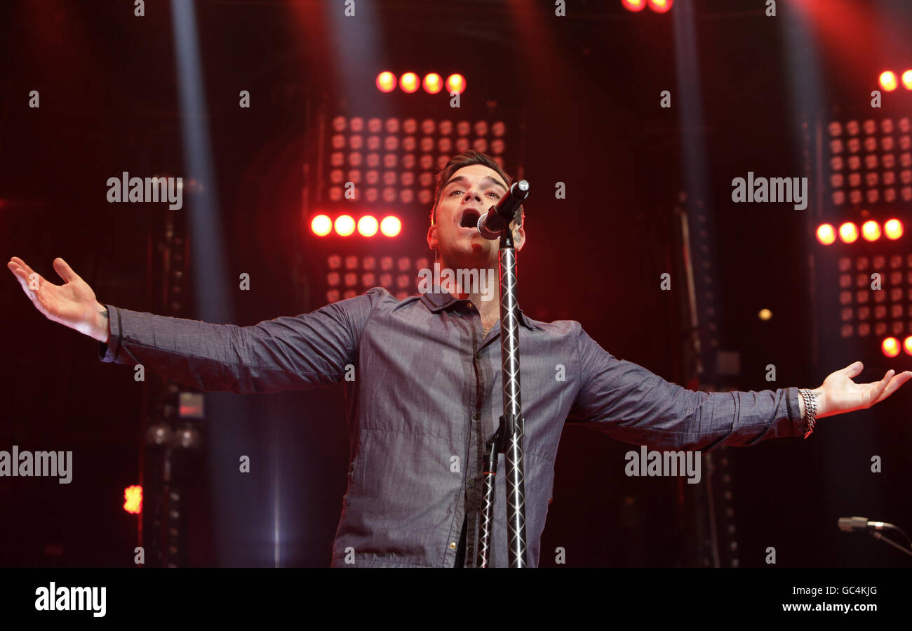 Robbie Williams performing on stage at the BBC Electric Proms, at the ...