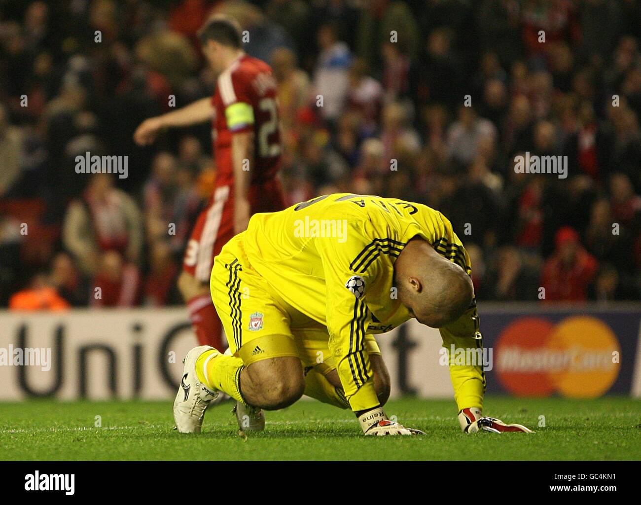 Liverpool goalkeeper Jose Reina reacts dejected after Olympique ...