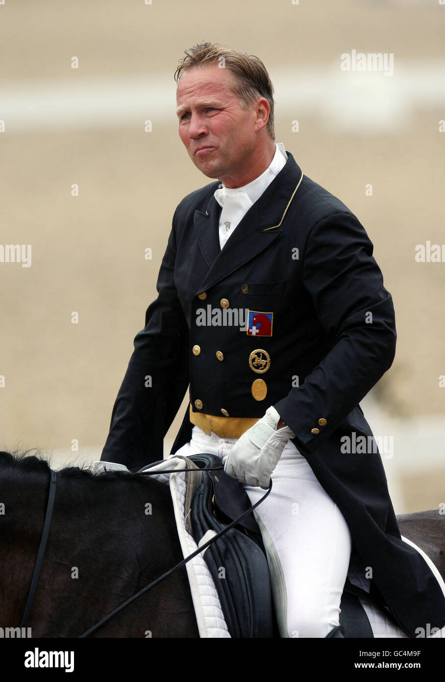 Christian Plage from Switzerland riding Regent competes in the FEI ...