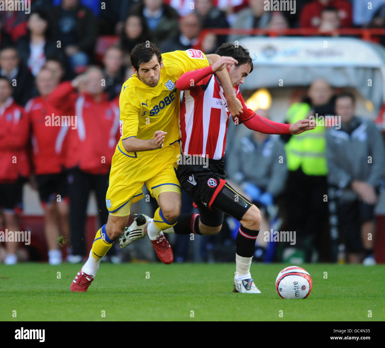 Sheffield United's Keith Tracey battles with Cardiff City's Joe Ledley ...