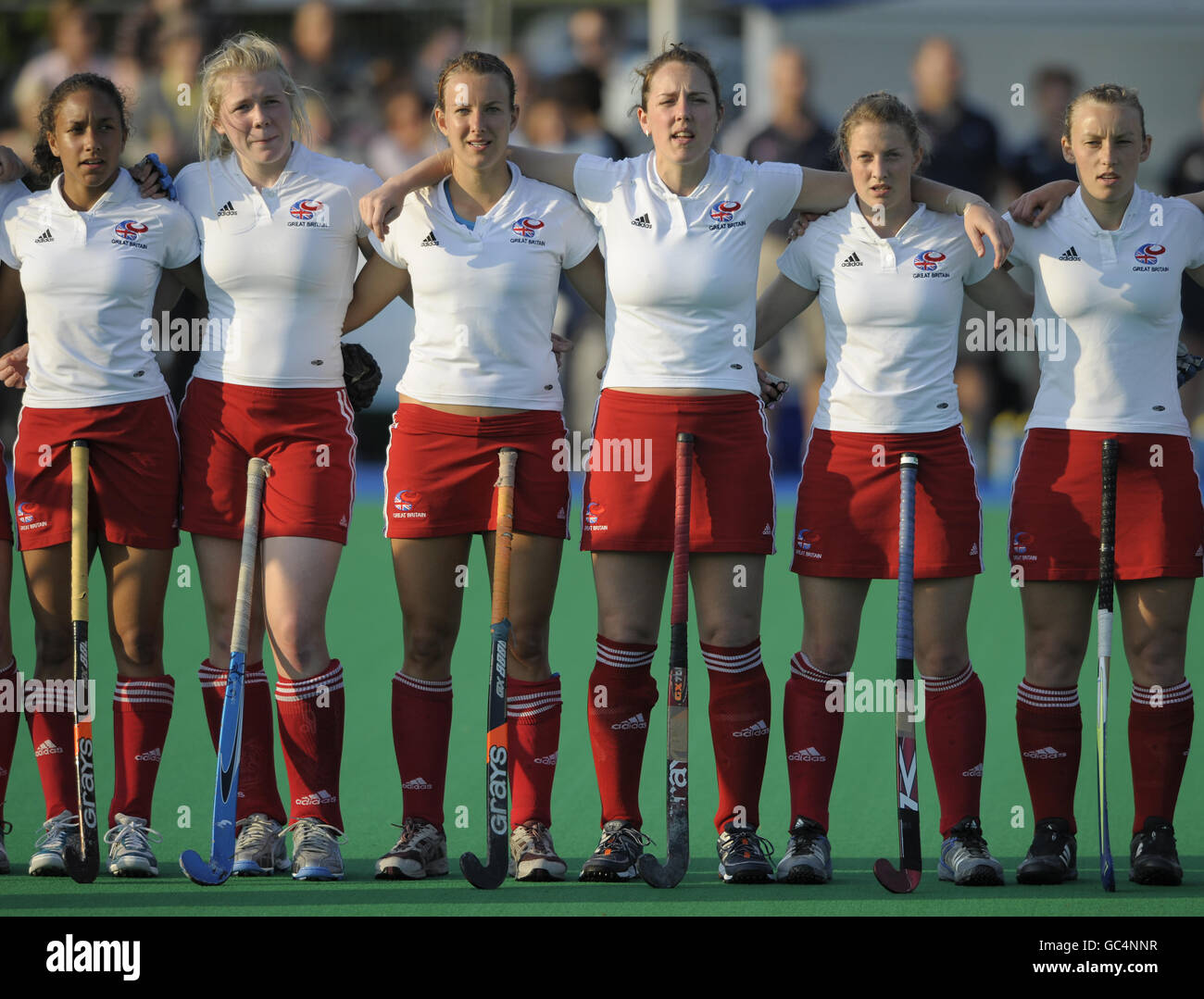 The Great Britain Women's team stand with their arms around each other ...