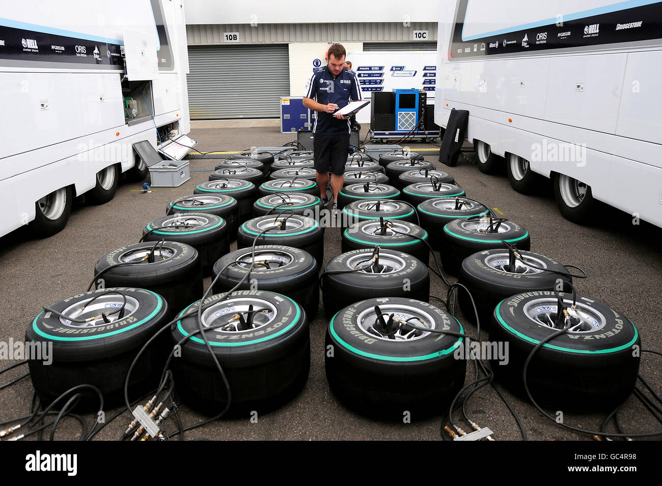Williams technicial the tyres during the paddock day at silverstone hi ...