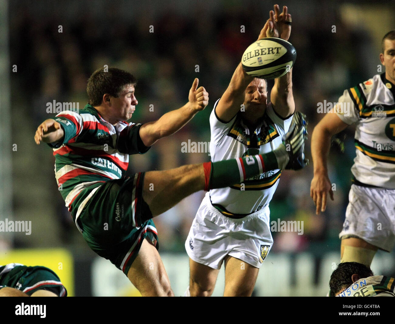 Northampton Saints' Alan Dickens charges down a kick by Leicester ...