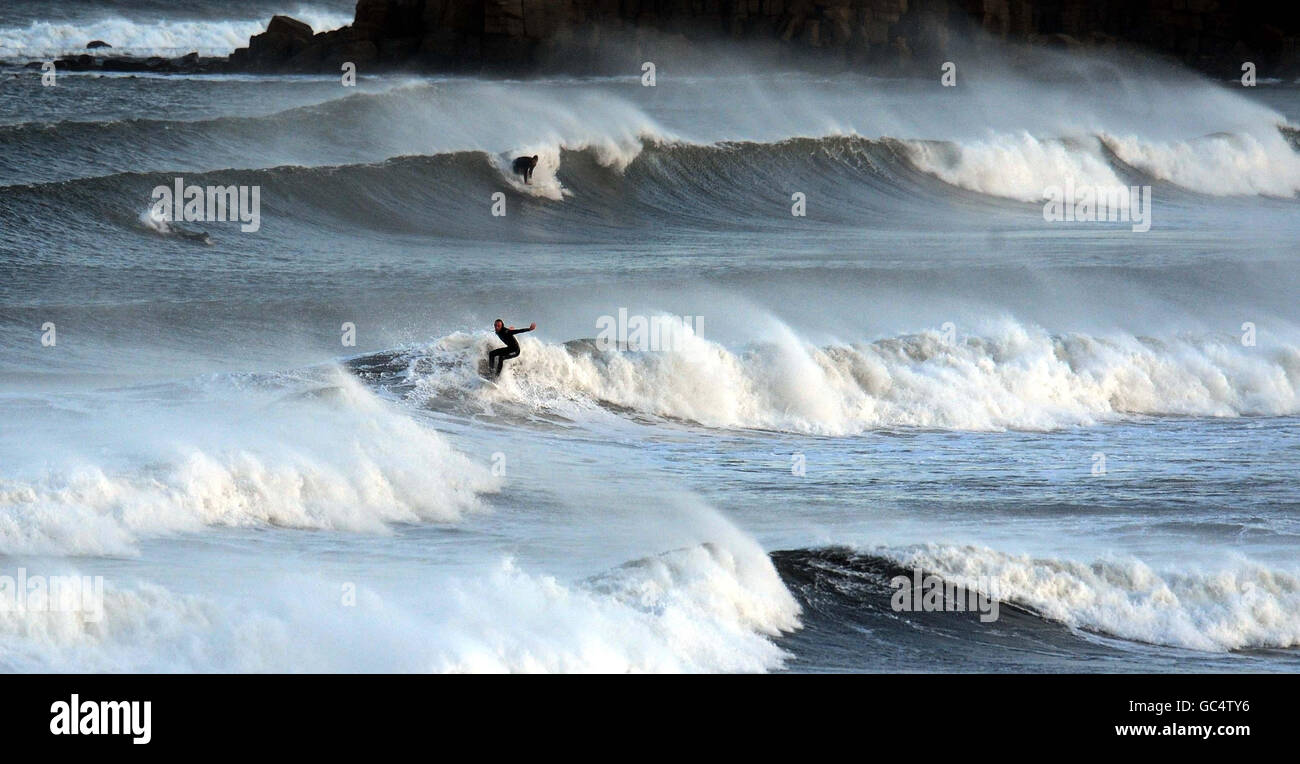 Surfers enjoy the surf at Tynemouth, North Tyneside,Tyne and Wear, as ...