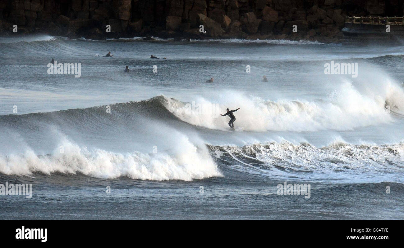 Surfers enjoy the surf at Tynemouth, North Tyneside,Tyne and Wear, as ...