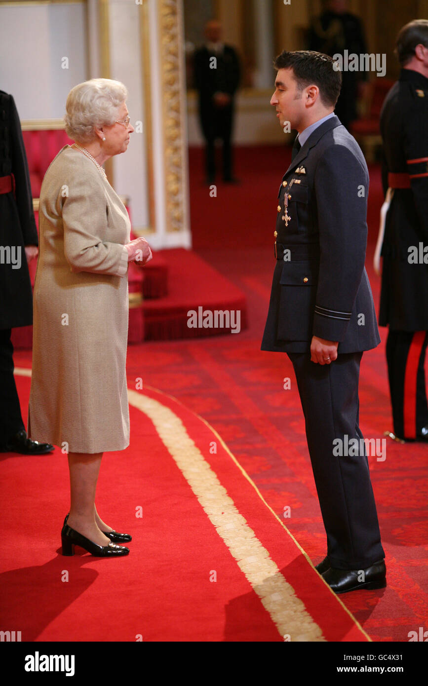 Flight Lieutenant Kevin Harris, Royal Air Force, is decorated with the ...