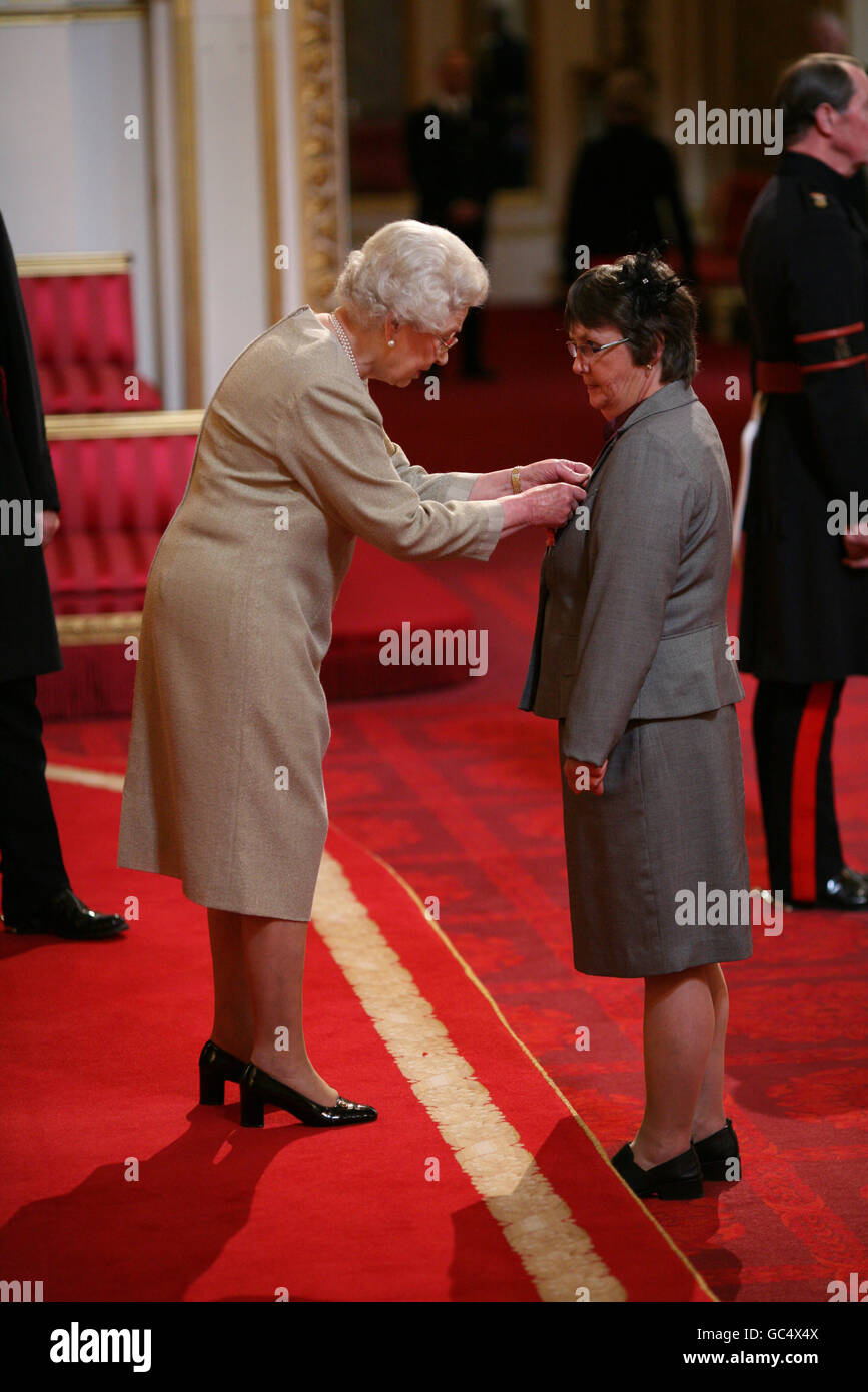 Miss Barbara Benfield from Alderney is made an MBE by The Queen at ...