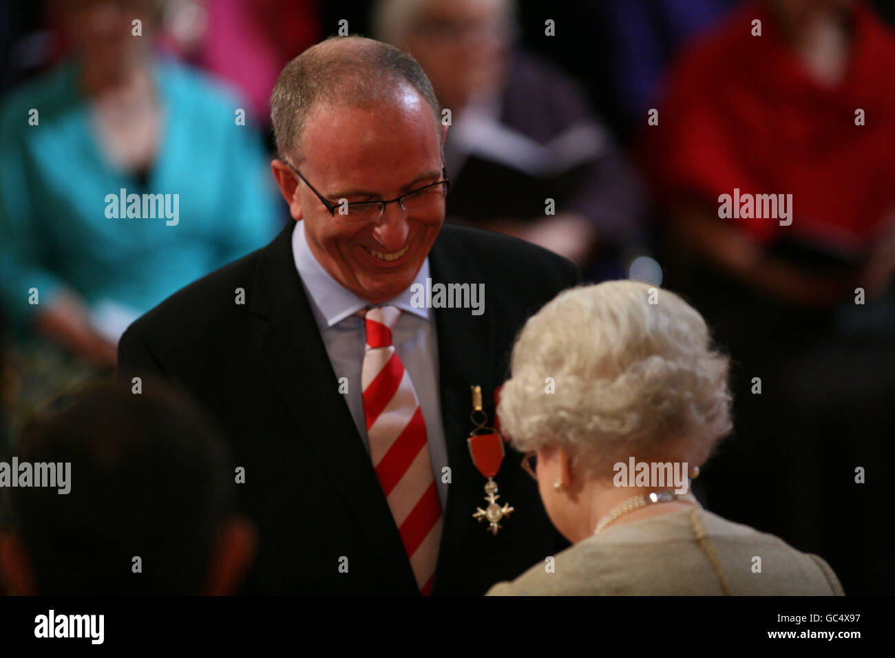 Mr. Andrew Bennett from Luton is made an MBE by The Queen at Buckingham ...
