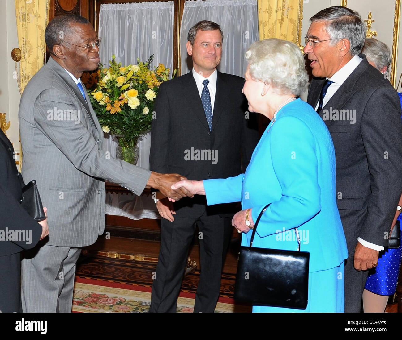 Britain's Queen Elizabeth II is introduced to Chief Justice Pius Langa ...