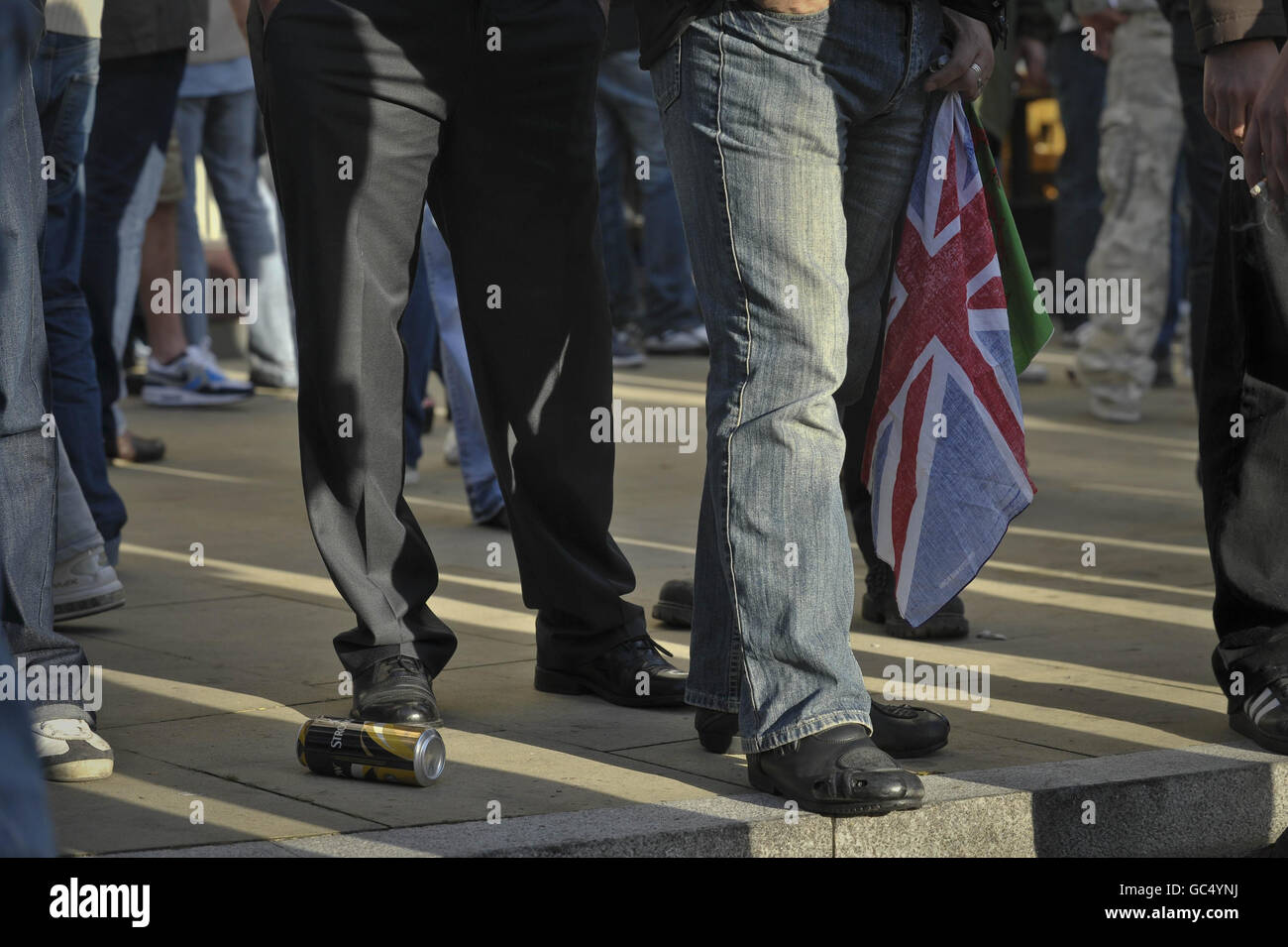 A Welsh Defence League protester holds a Union flag as the their group ...