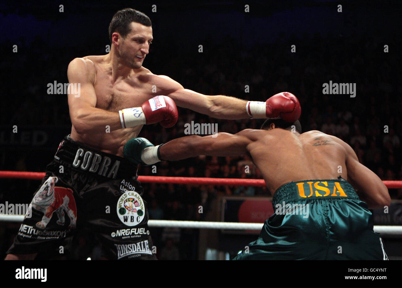 Great Britain's Carl Froch (left) exchanges punches during his split ...