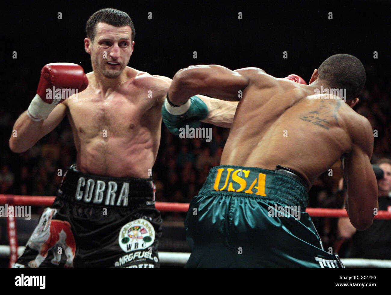 Great Britain's Carl Froch (left) lands a left jab to the chin of Andre ...