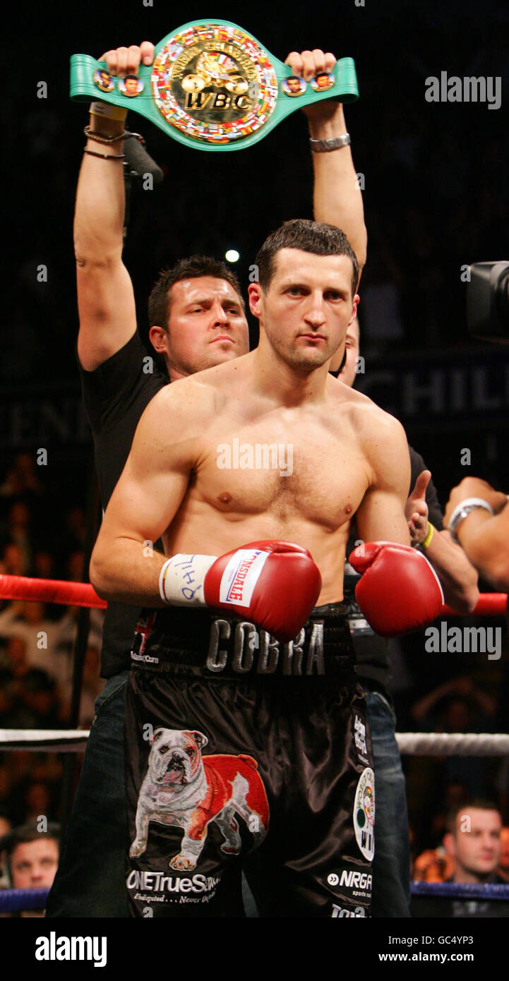 Great Britain's Carl Froch before the fight with his WBC held aloft ...