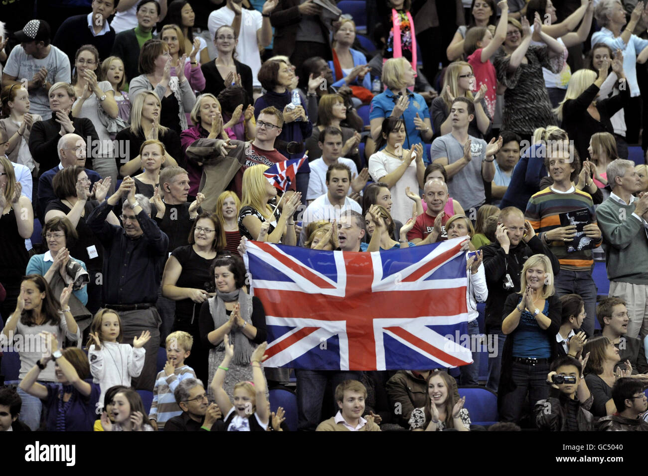 The crowd react after Great Britain's Beth Tweddle wins gold during the ...