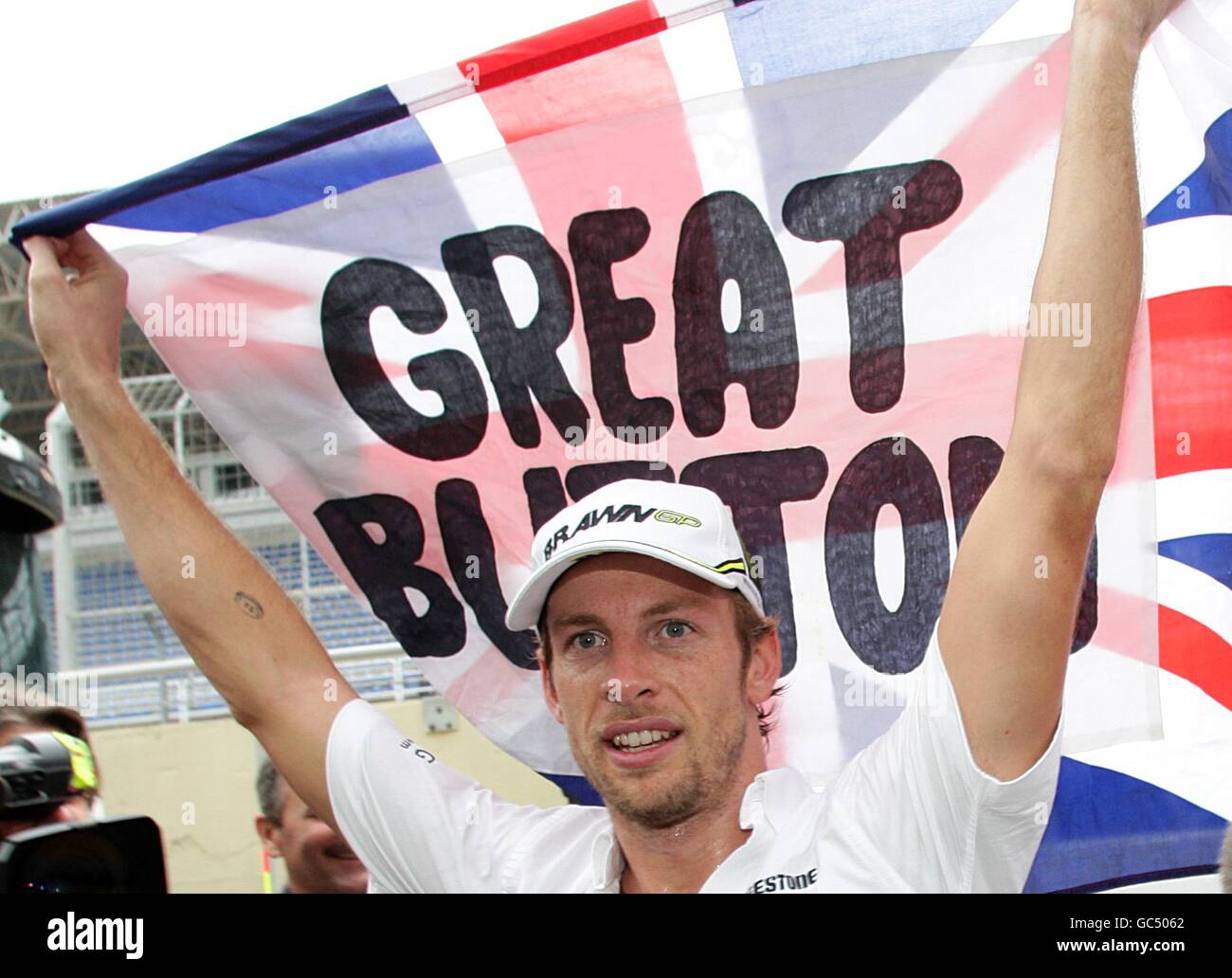 Brawn GP's Jenson Button celebrates after winning the World ...