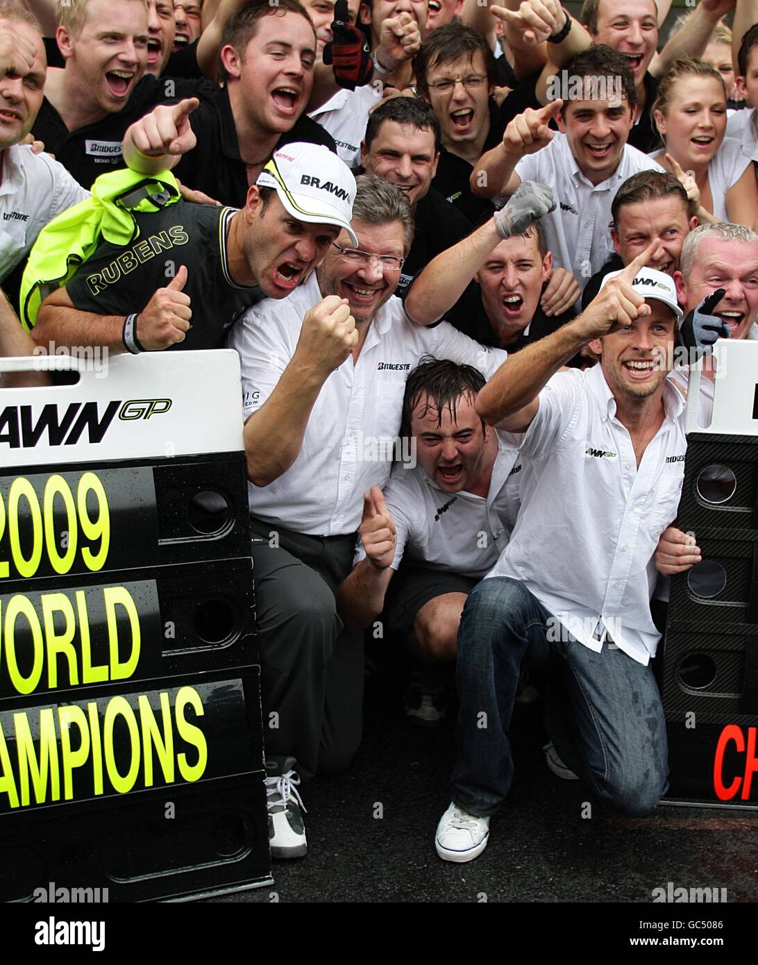 Jenson Button (bottom right) celebrates with Rubens Barrichello (bottom ...