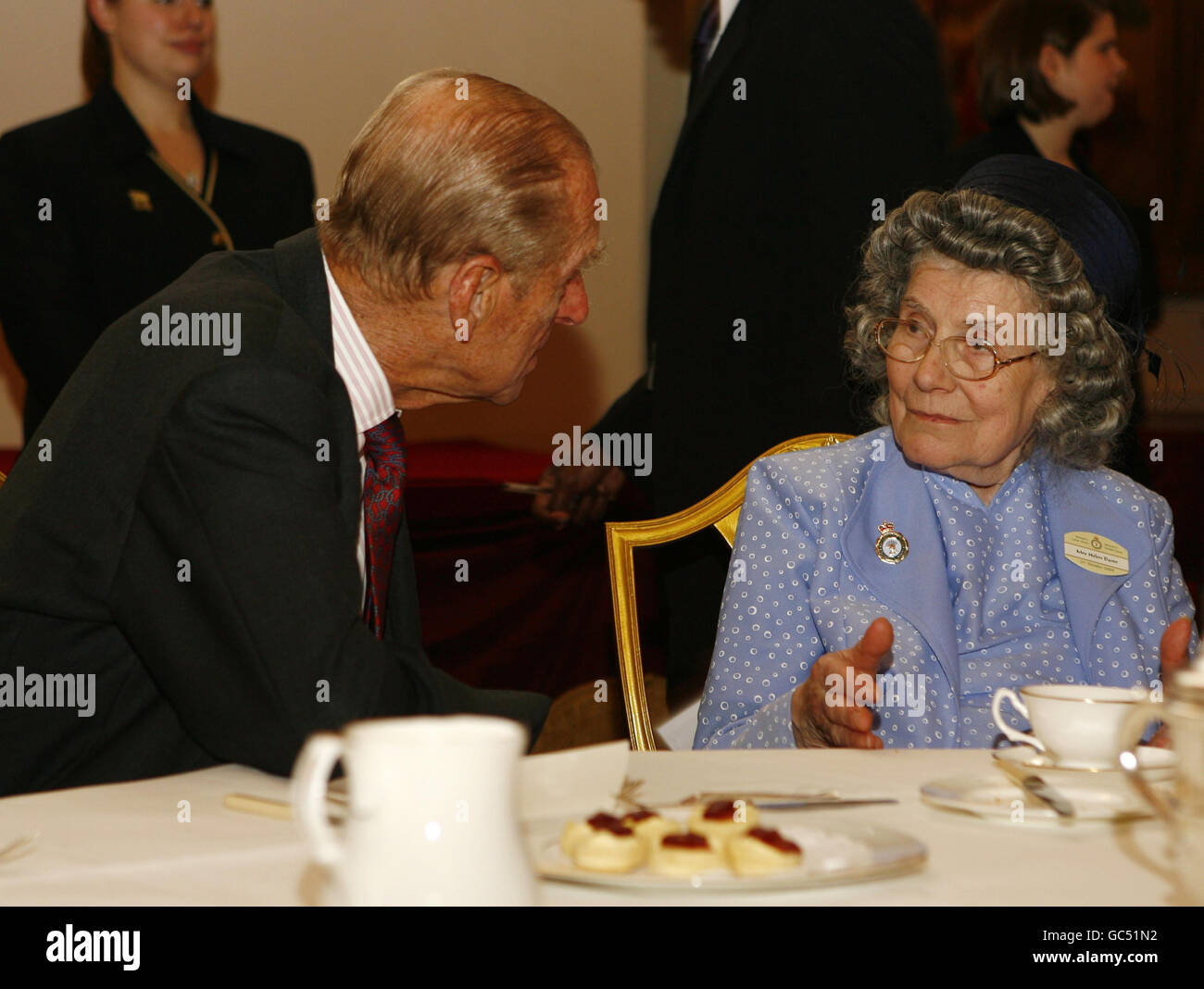 Queen hosts Women's Land Army and Timbers Corps Tea Stock Photo - Alamy