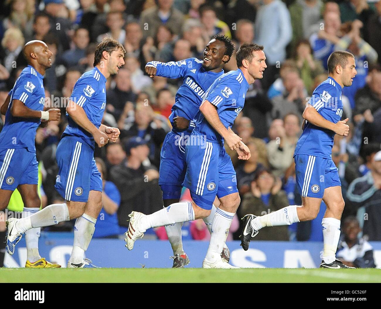 Chelsea's Michael Essien (centre) celebrates scoring their third goal ...
