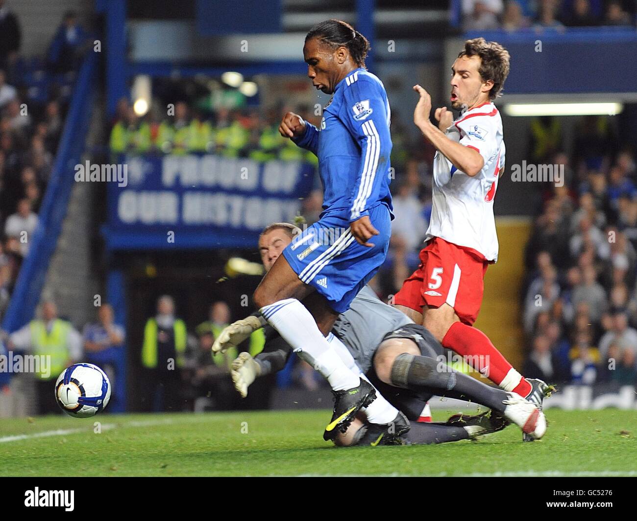 Chelsea's Didier Drogba (centre) is challenged by Blackburn Rovers ...