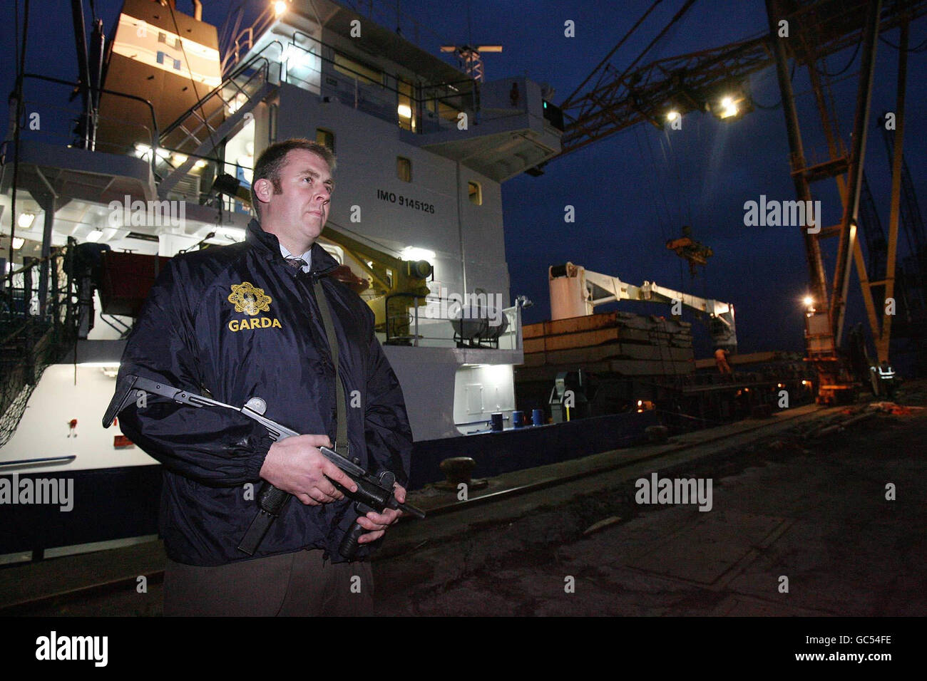 Armed Gardai at the scene in Greenore Port, Co. Louth, where cigarettes ...