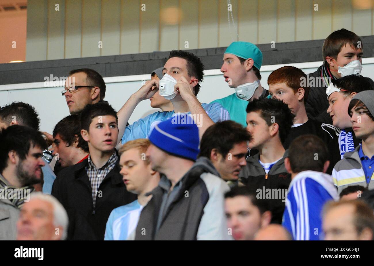 Peterborough United fans wear face masks in the stands after an ...