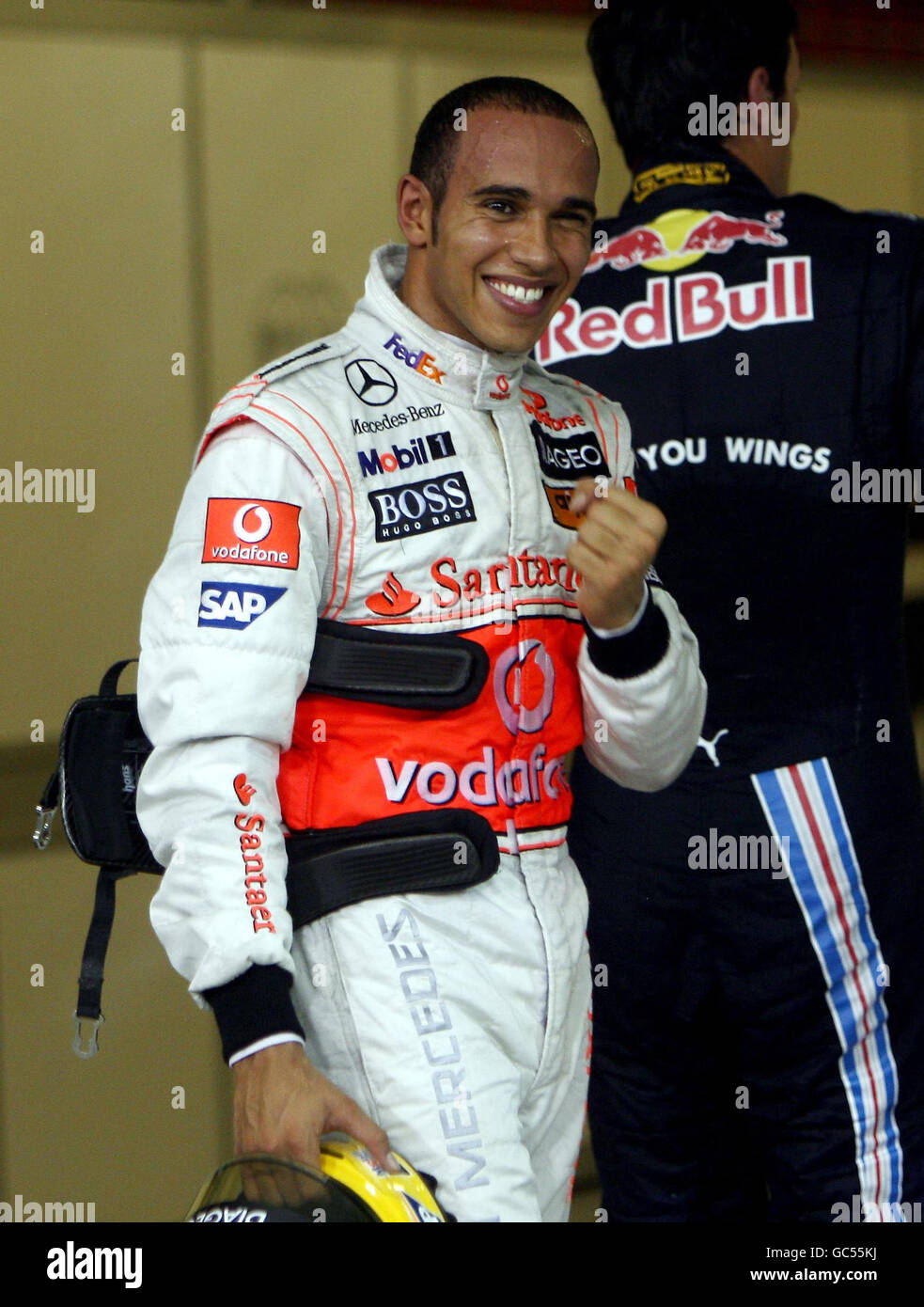 Vodafone McLaren driver Lewis Hamilton celebrates his pole position for ...