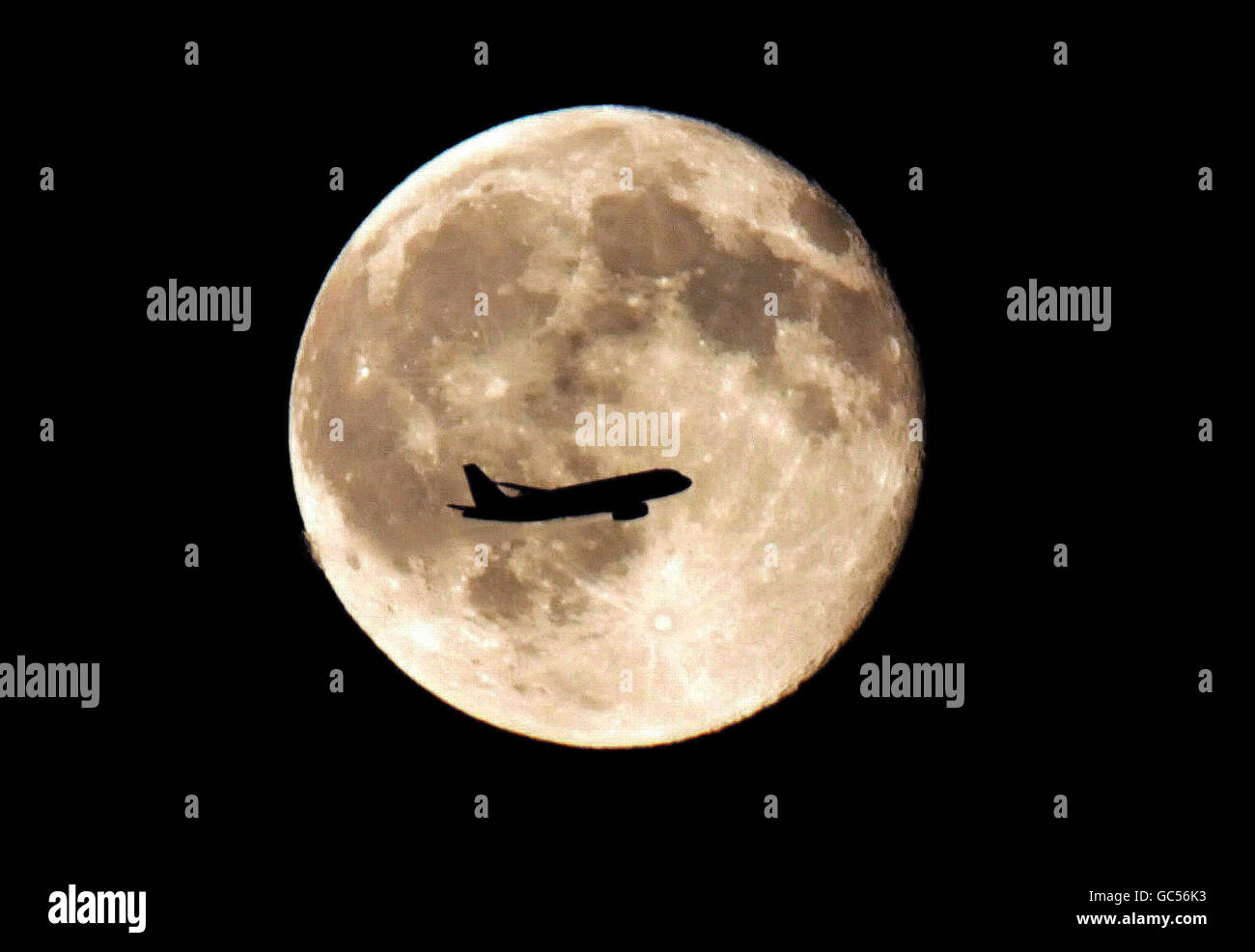 Plane and Moon Stock Photo - Alamy