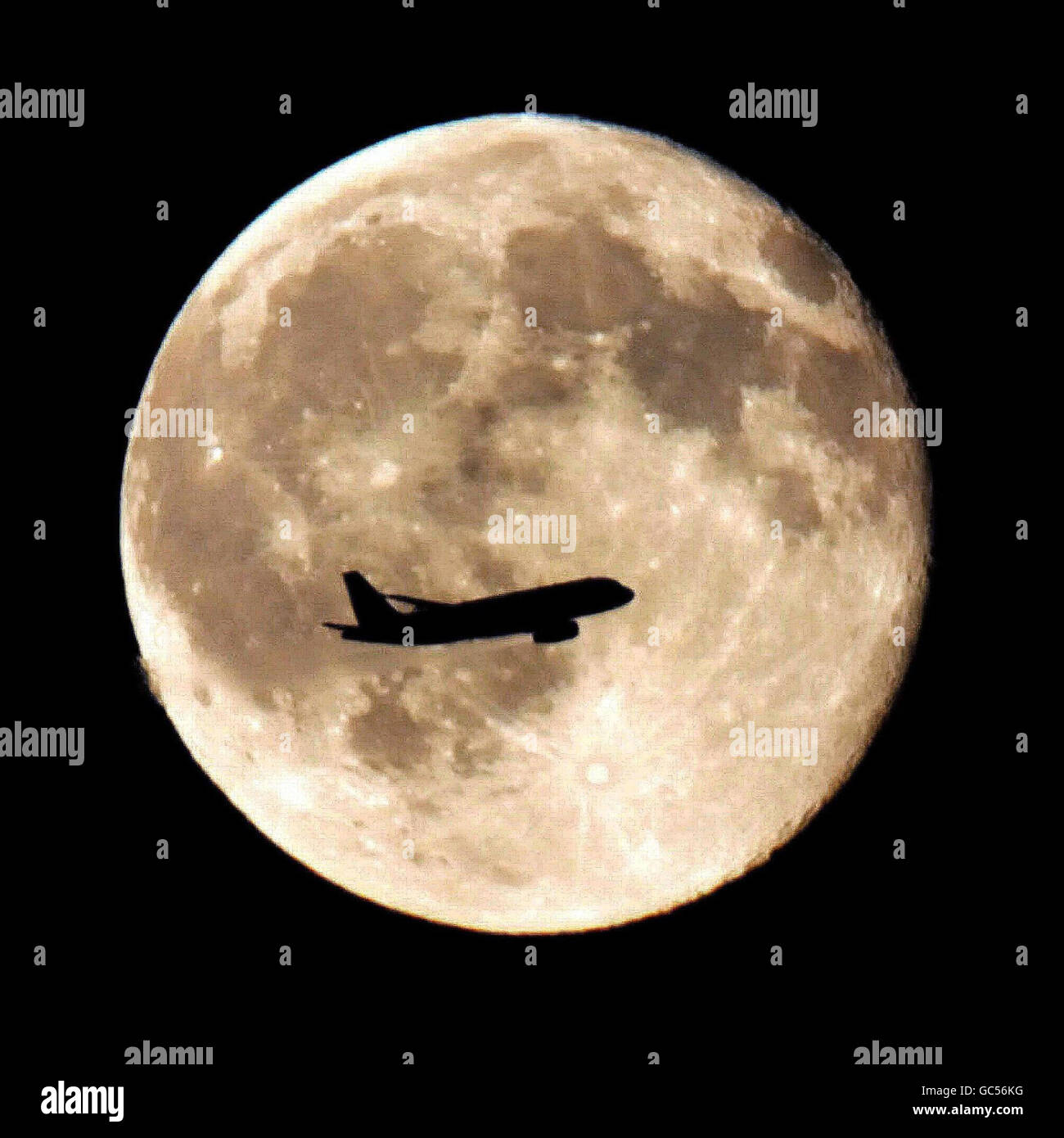 Plane and Moon Stock Photo - Alamy