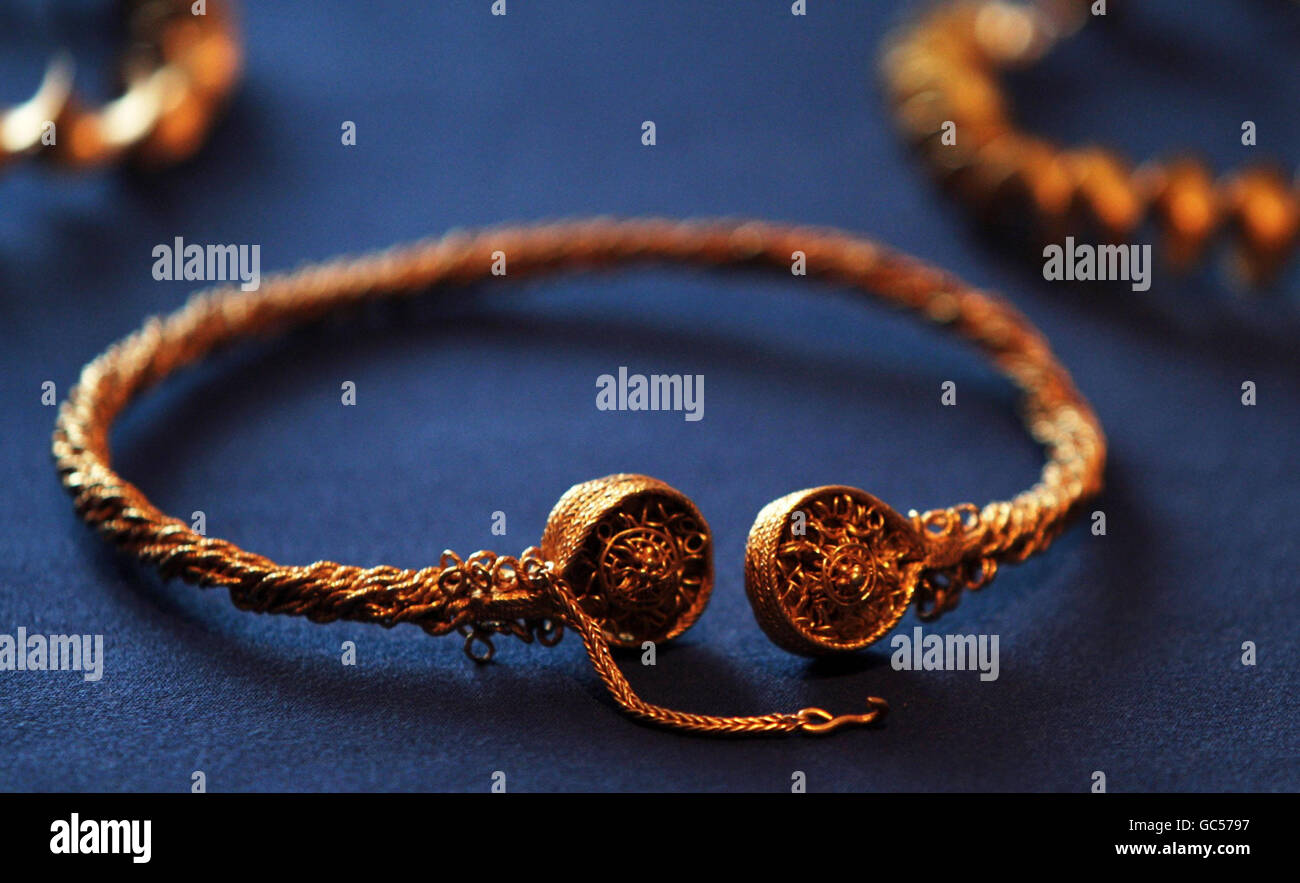 Four gold Iron Age neck ornaments or torcs, dating from the between the ...
