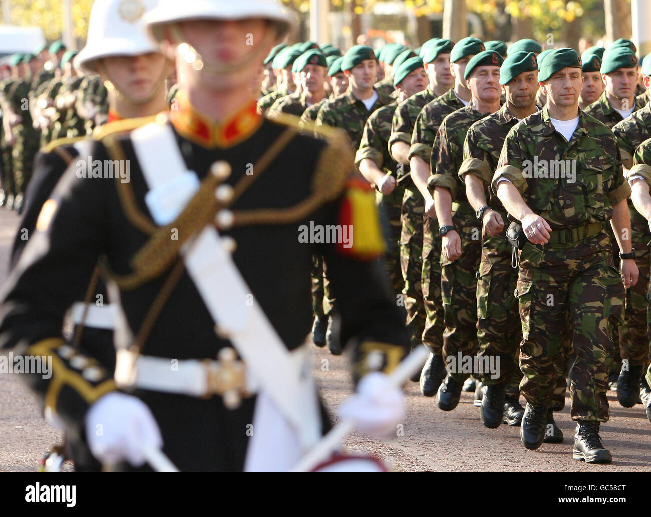A group of around 90 former Royal Marines, joined by the Corps of Drums ...