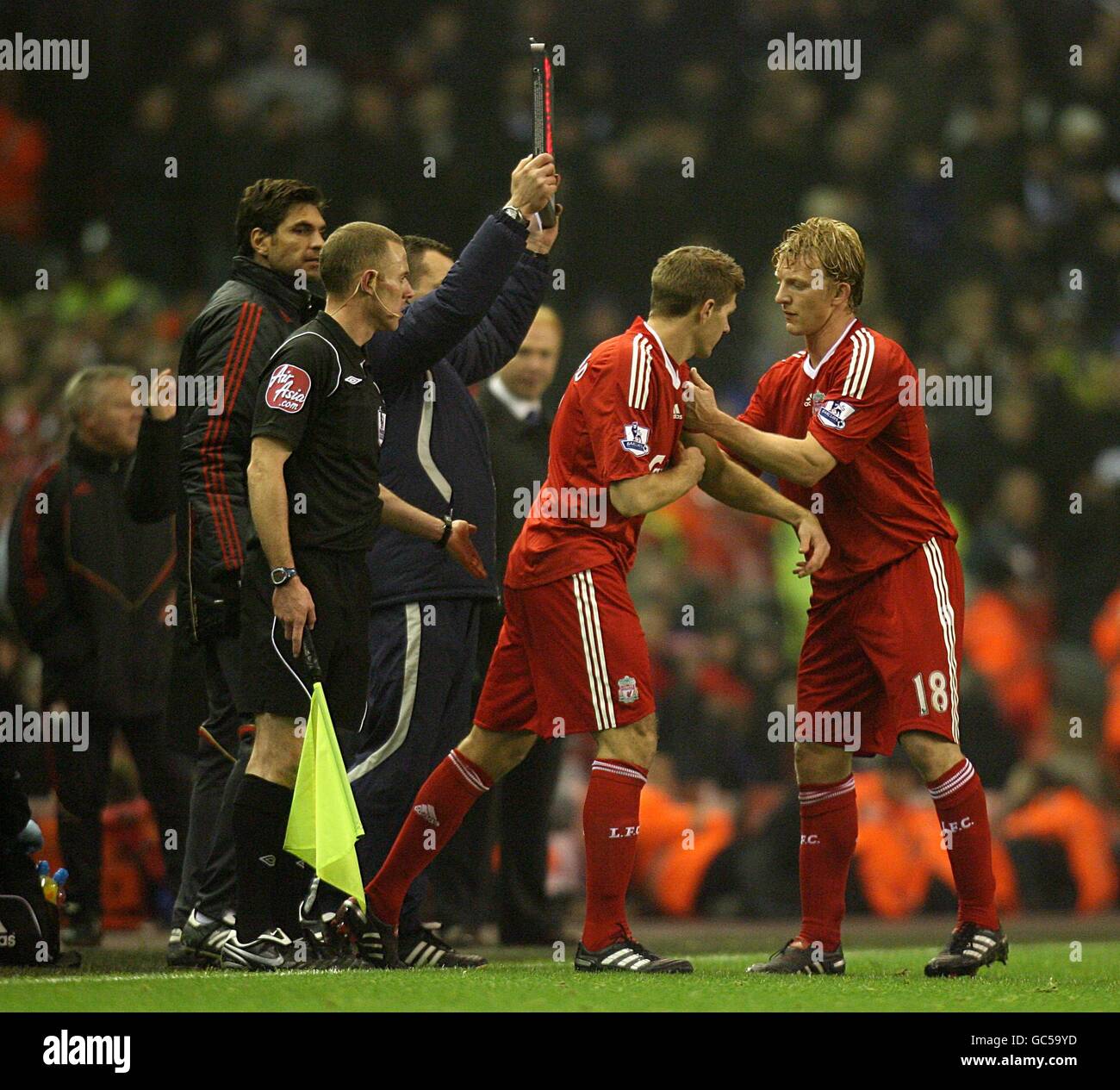 Liverpool's Steven Gerrard (centre) is greated by team mate Dirk Kuyt ...