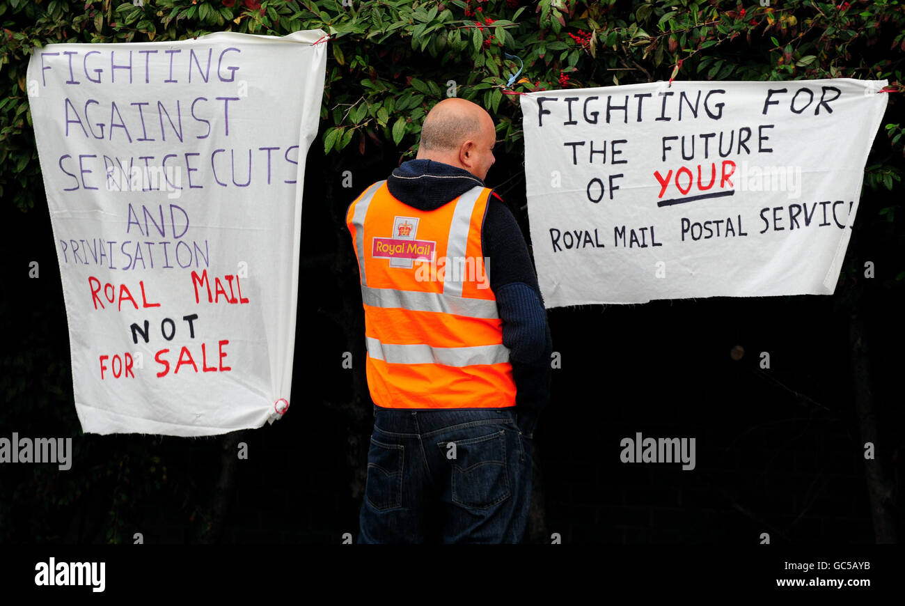 A Royal Mail postal worker can be seen outside the centre in Coventry ...