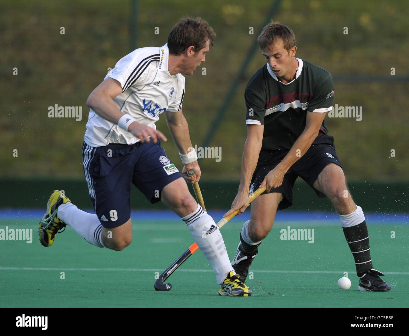 East Grinstead's Rick Gay (left) challenges with Surbiton's Matt Daly ...