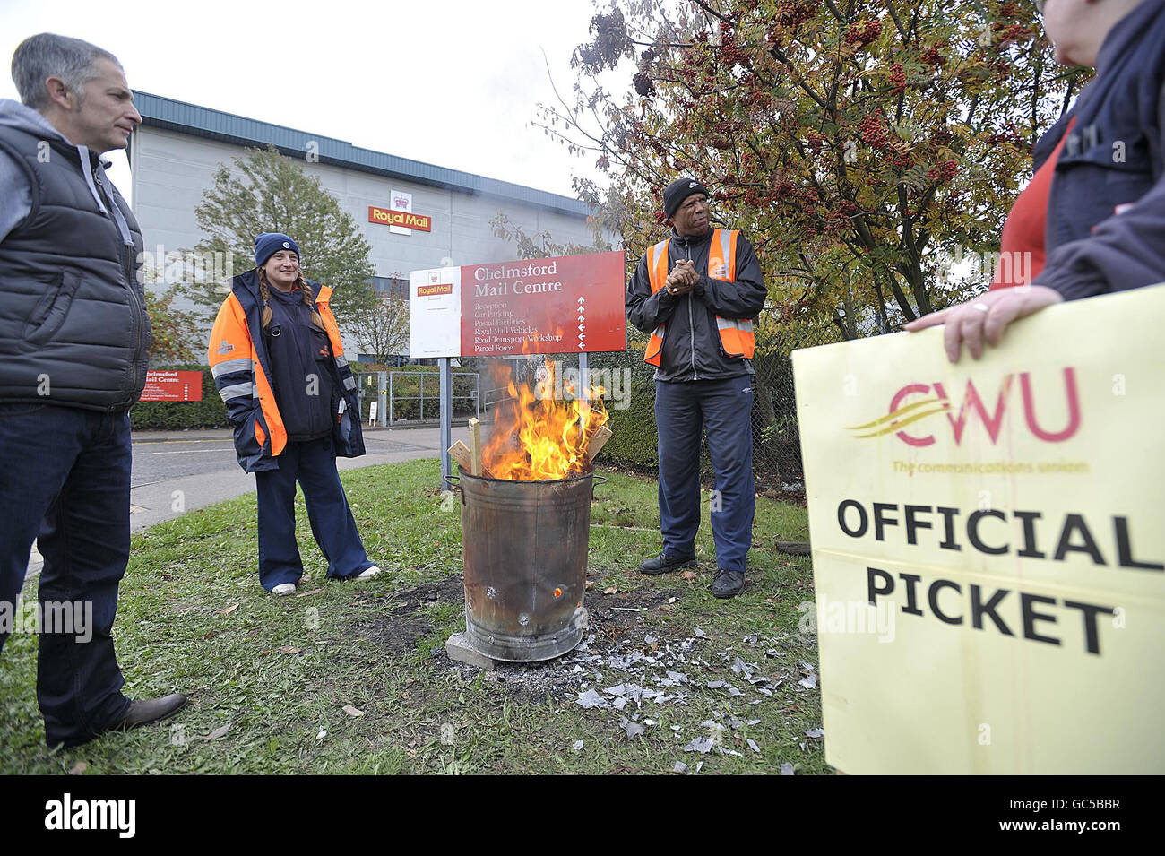 Striking postal workers man a picket line outside the Royal Mail ...