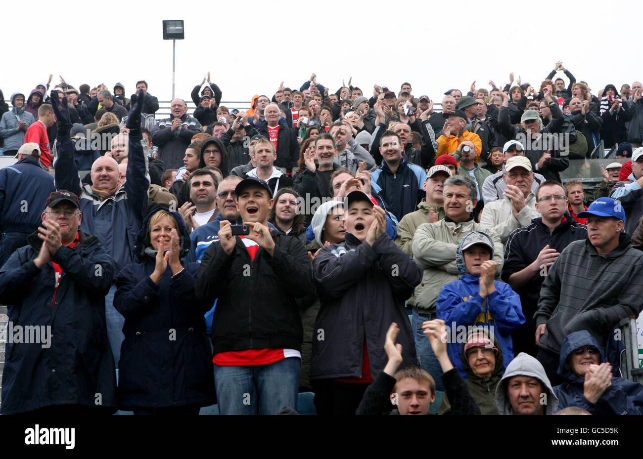 The gillingham fans watch the action hi-res stock photography and ...