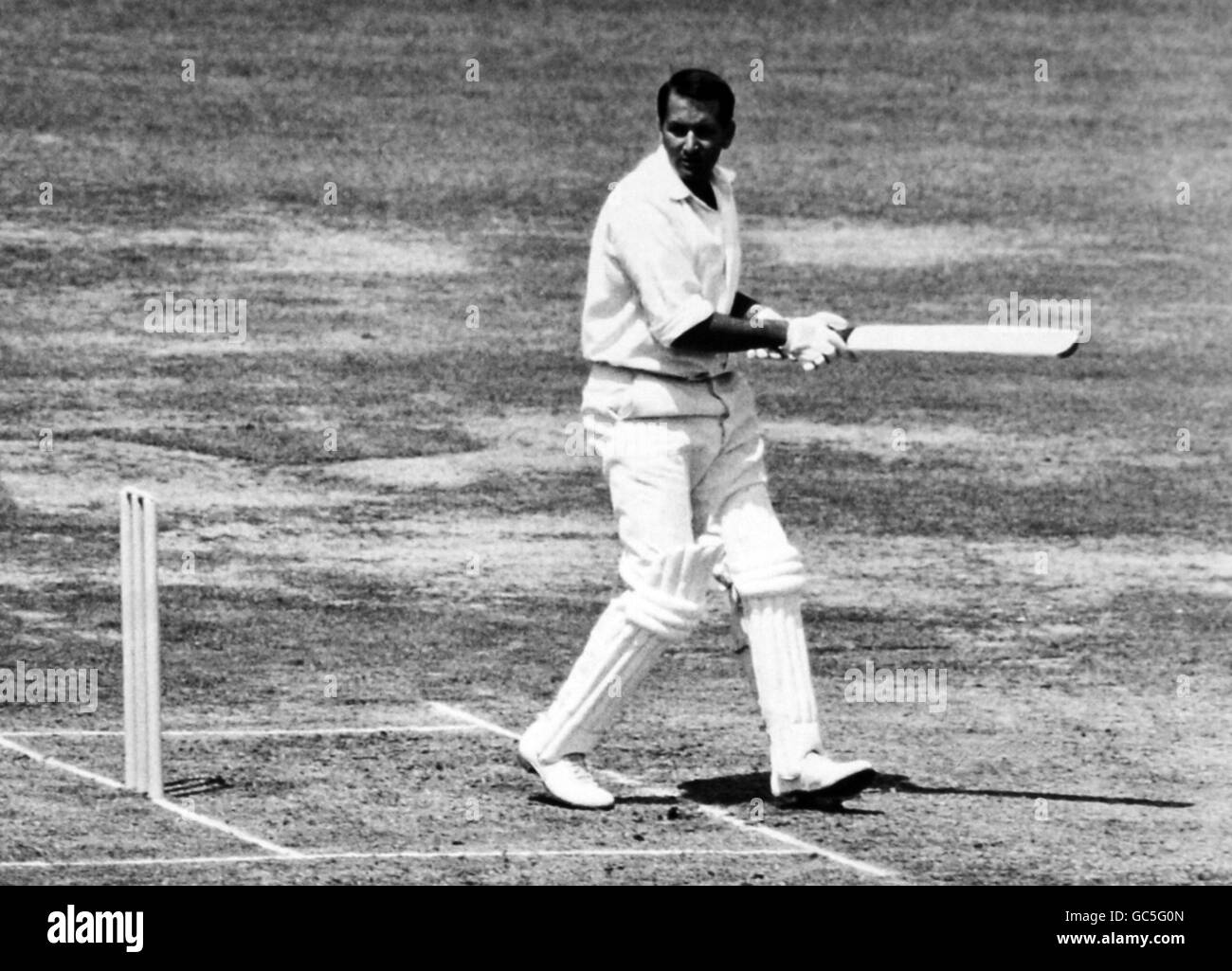 Basil D'Oliveira (England) cuts a ball from Wes Hall (West Indies Stock ...