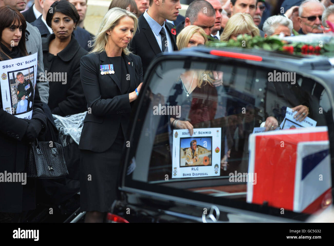 Christina (third left) wife of Staff Sergeant Olaf Schmid watches as ...
