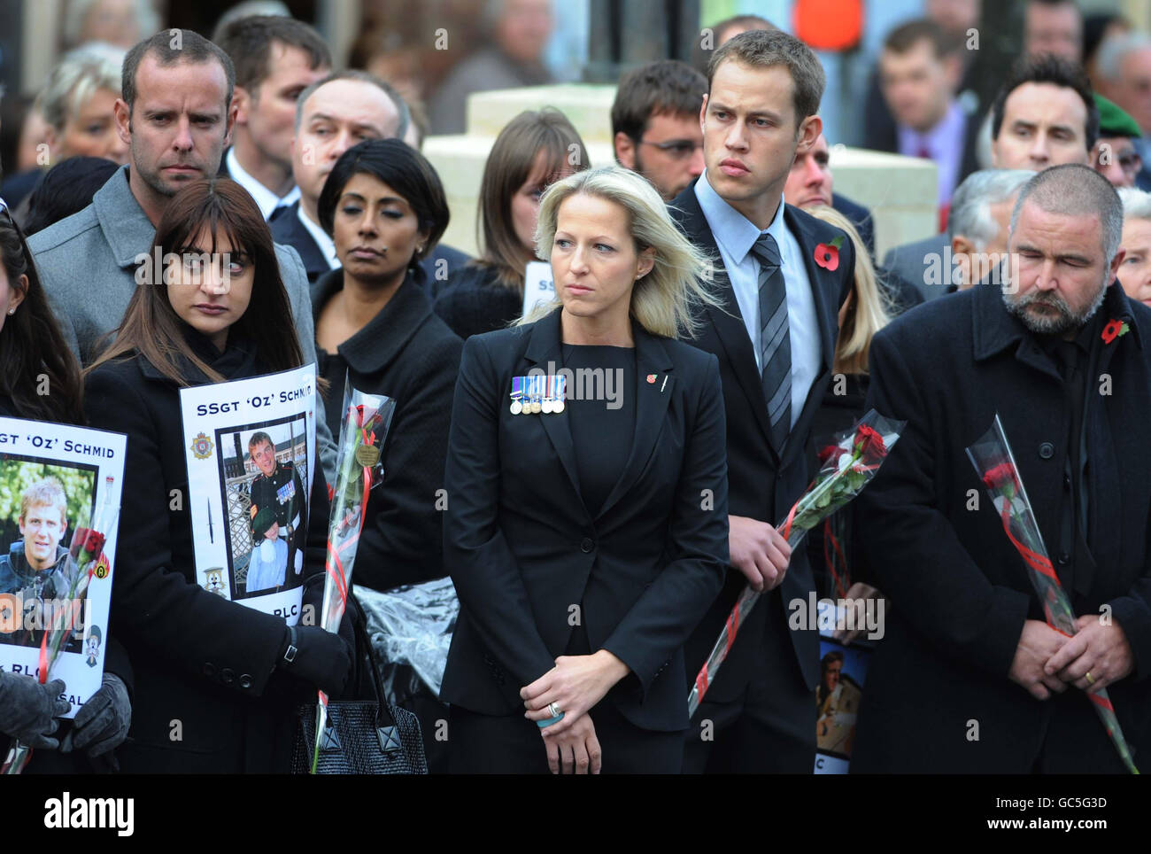 Christina (centre) wife of Staff Sergeant Olaf Schmid waits for the ...