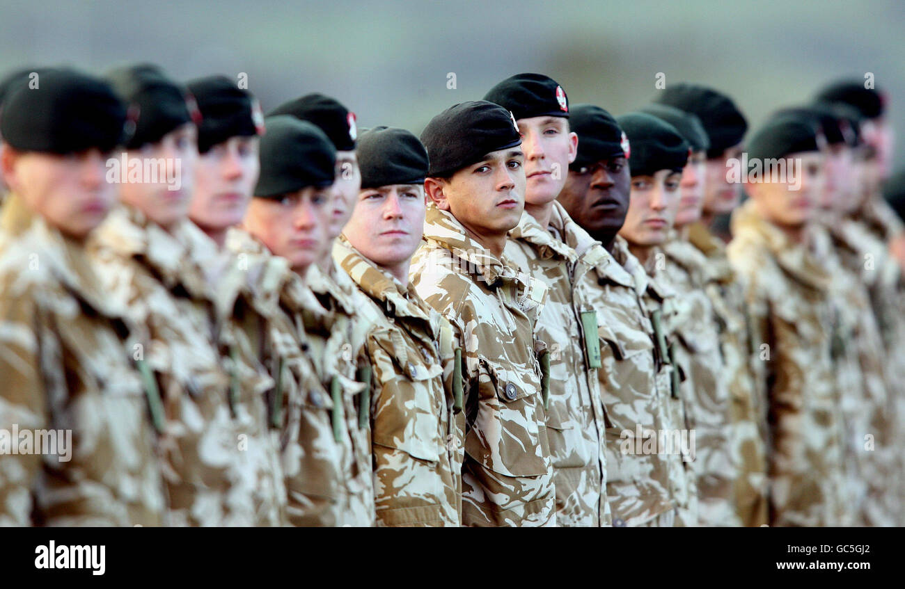 Soldiers of 2 Rifles wait to receive their operational medals at ...