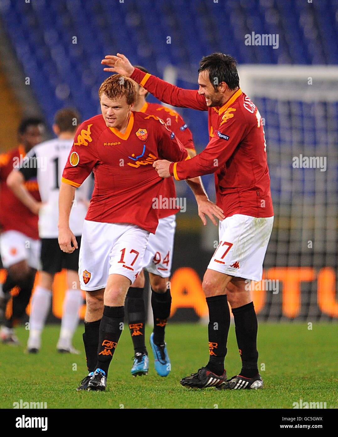 AS Roma's John Arne Riise (left) celebrates with team mate Marco ...