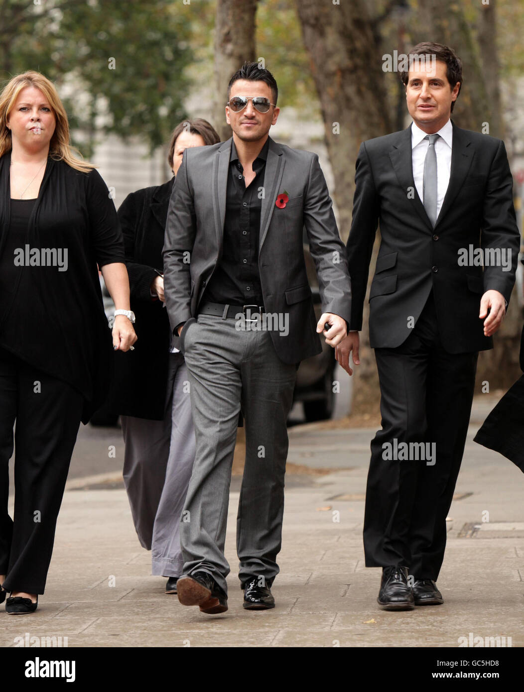 Peter Andre (centre) leaves the Royal Courts of Justice in central ...
