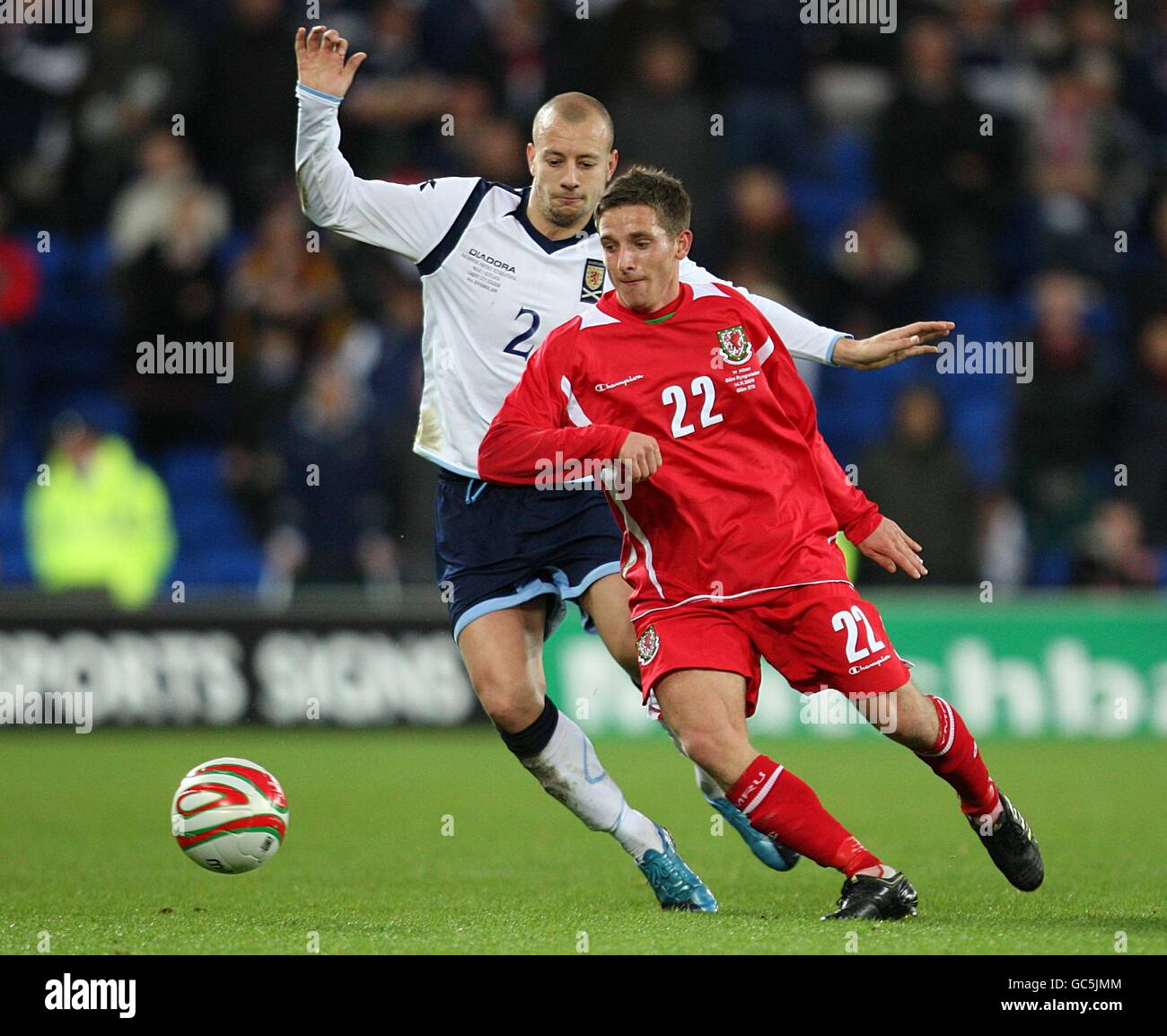 Wales' Joe Allen (right) and Scotland's Alan Hutton (left) battle for ...