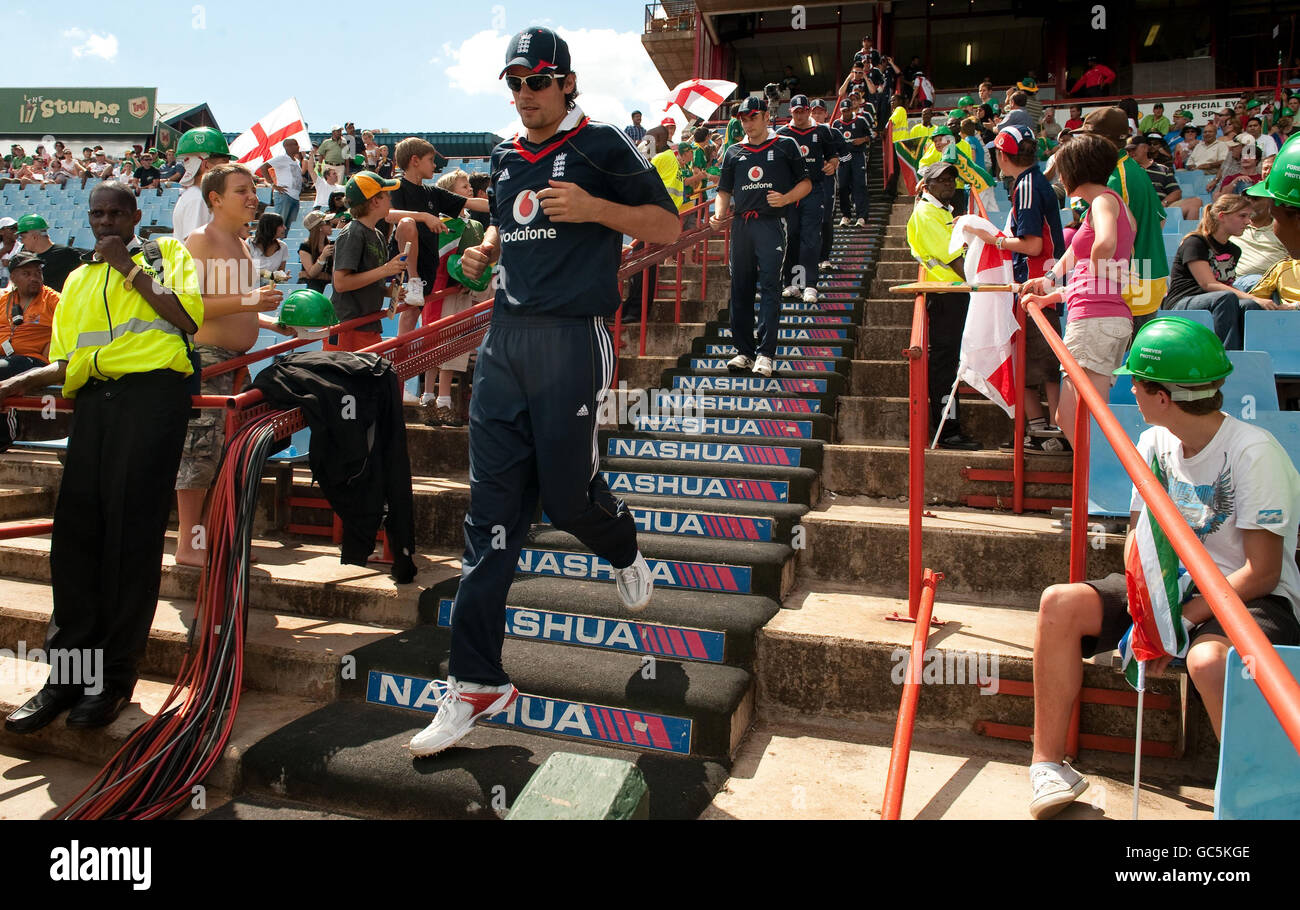 New England captain Alastair Cook leads out his team before their ...