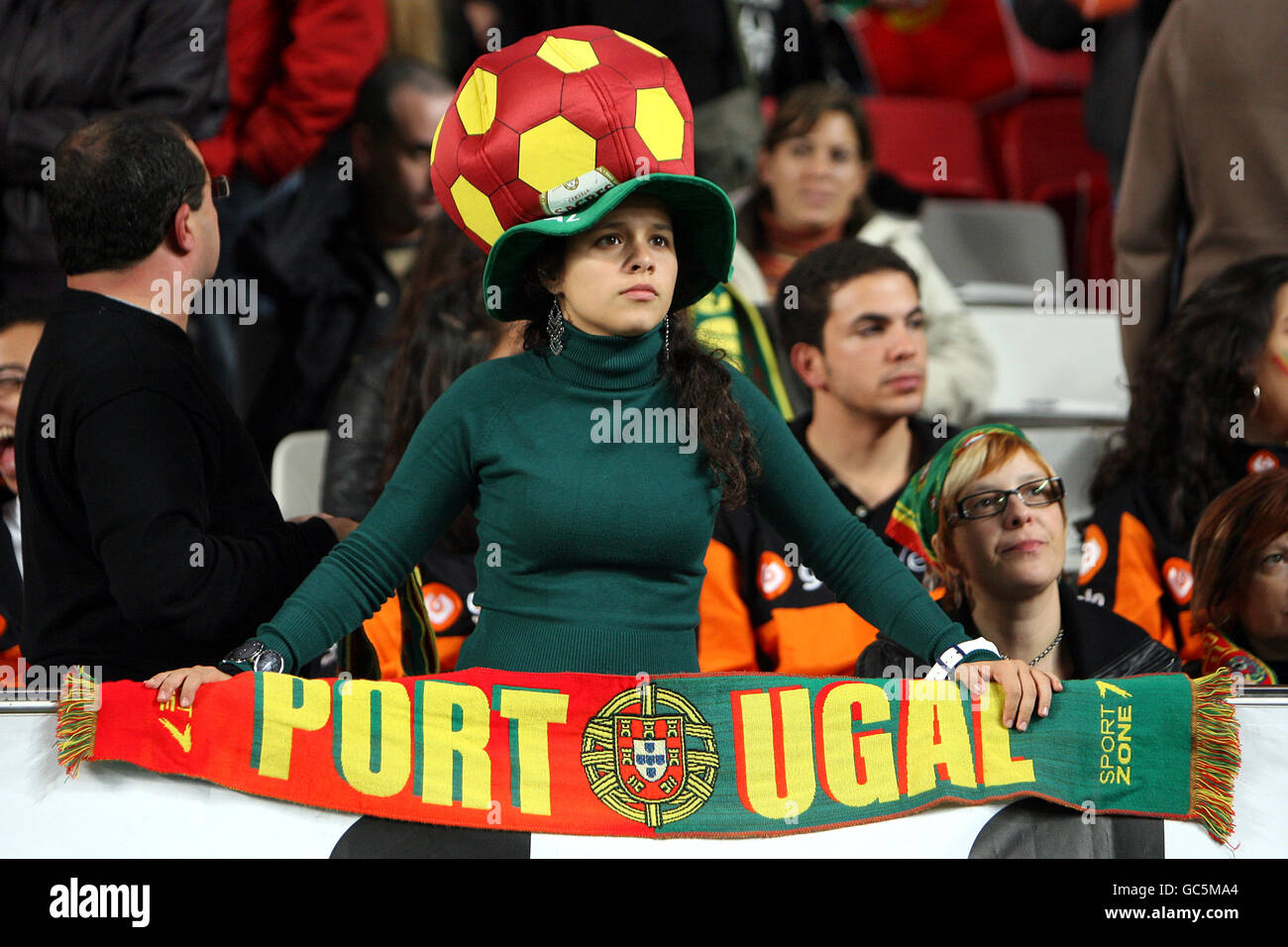 Portugal fan cheers on her side in the stands hi-res stock photography ...